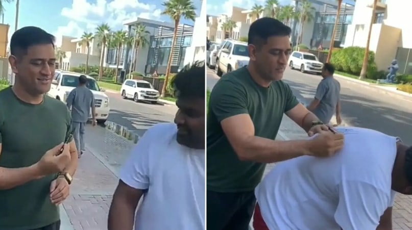 MS Dhoni Gives An Autograph To A Fan On His Back